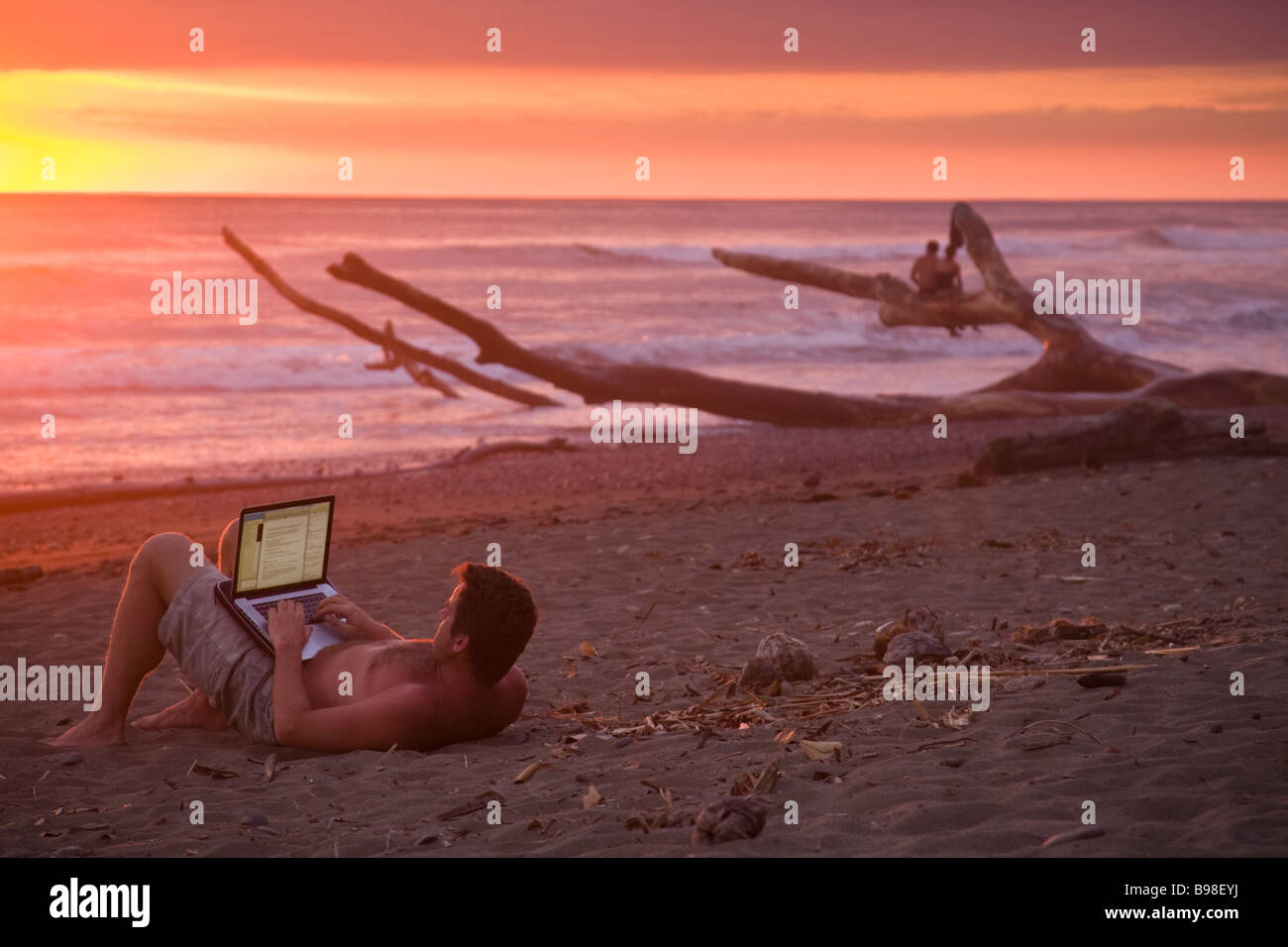 Laptop computer on beach waves hi-res stock photography and images - Alamy