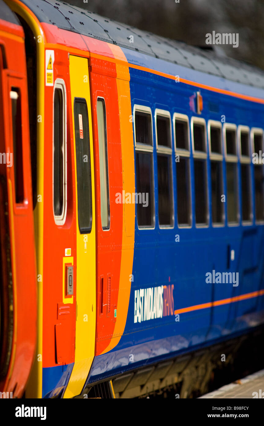 Commuter train pulling out of the local train station Stock Photo - Alamy
