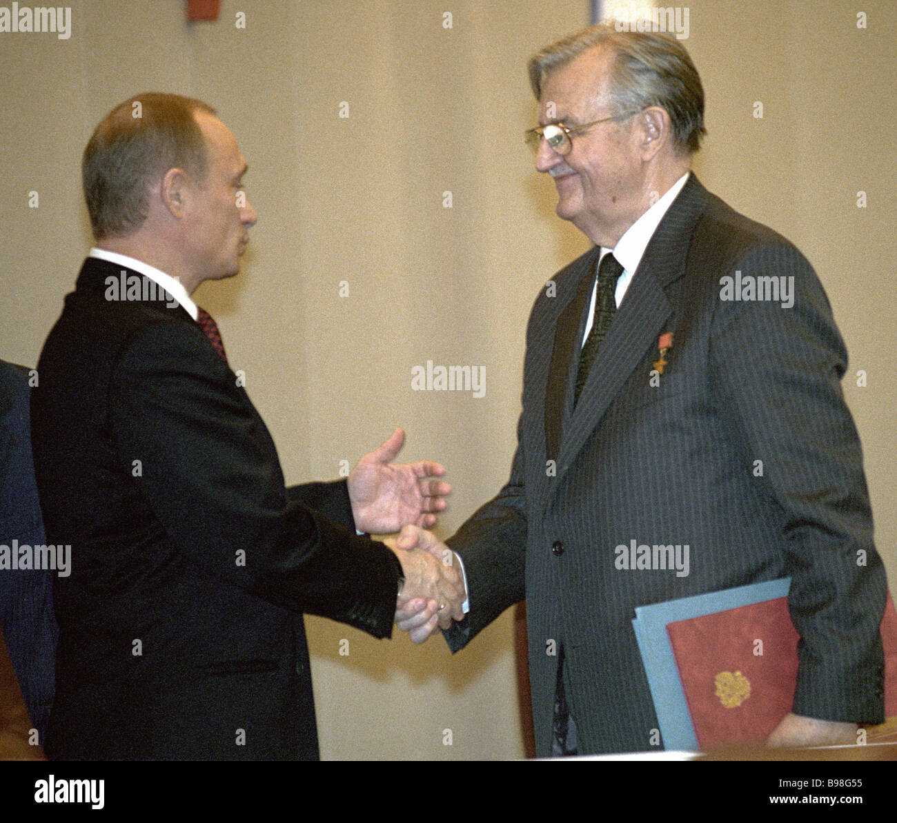 Russian President Vladimir Putin welcomes the State Duma veteran deputy ...