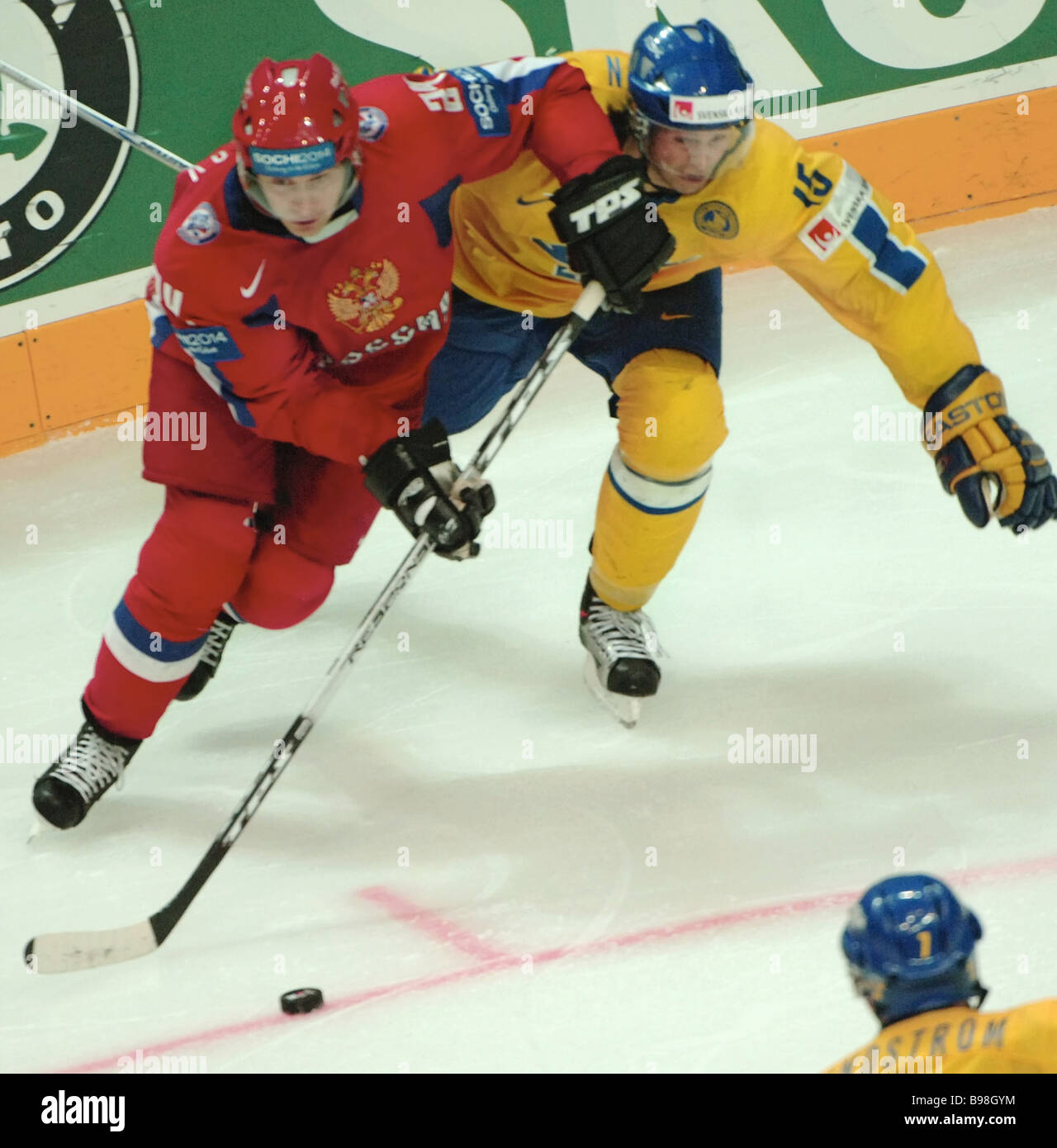 Russia s Alexander Frolov left and Sweden s Rickard Wallin fighting for ...