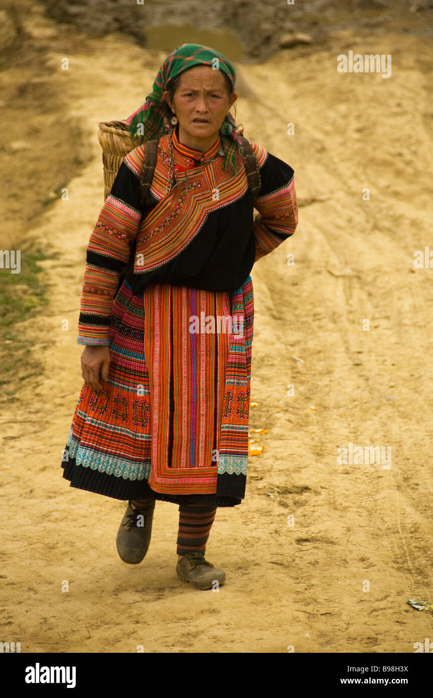 colorful Flower Hmong woman walking home from market in Cau Son near ... colorful Flower Hmong woman walking home from market in Cau Son near ...