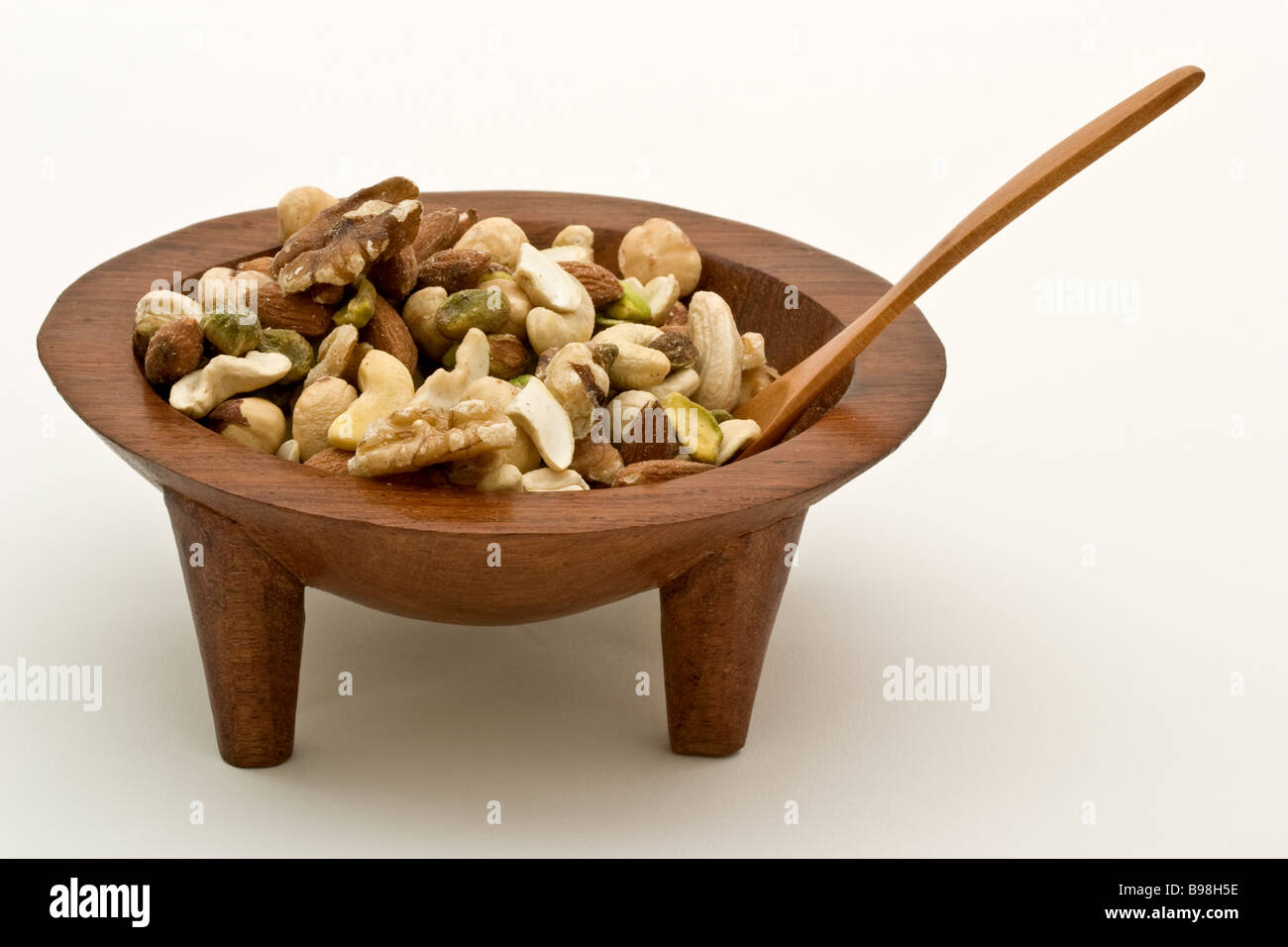 Fiji Kava bowl filled with nuts, with a wooden spoon Stock Photo - Alamy
