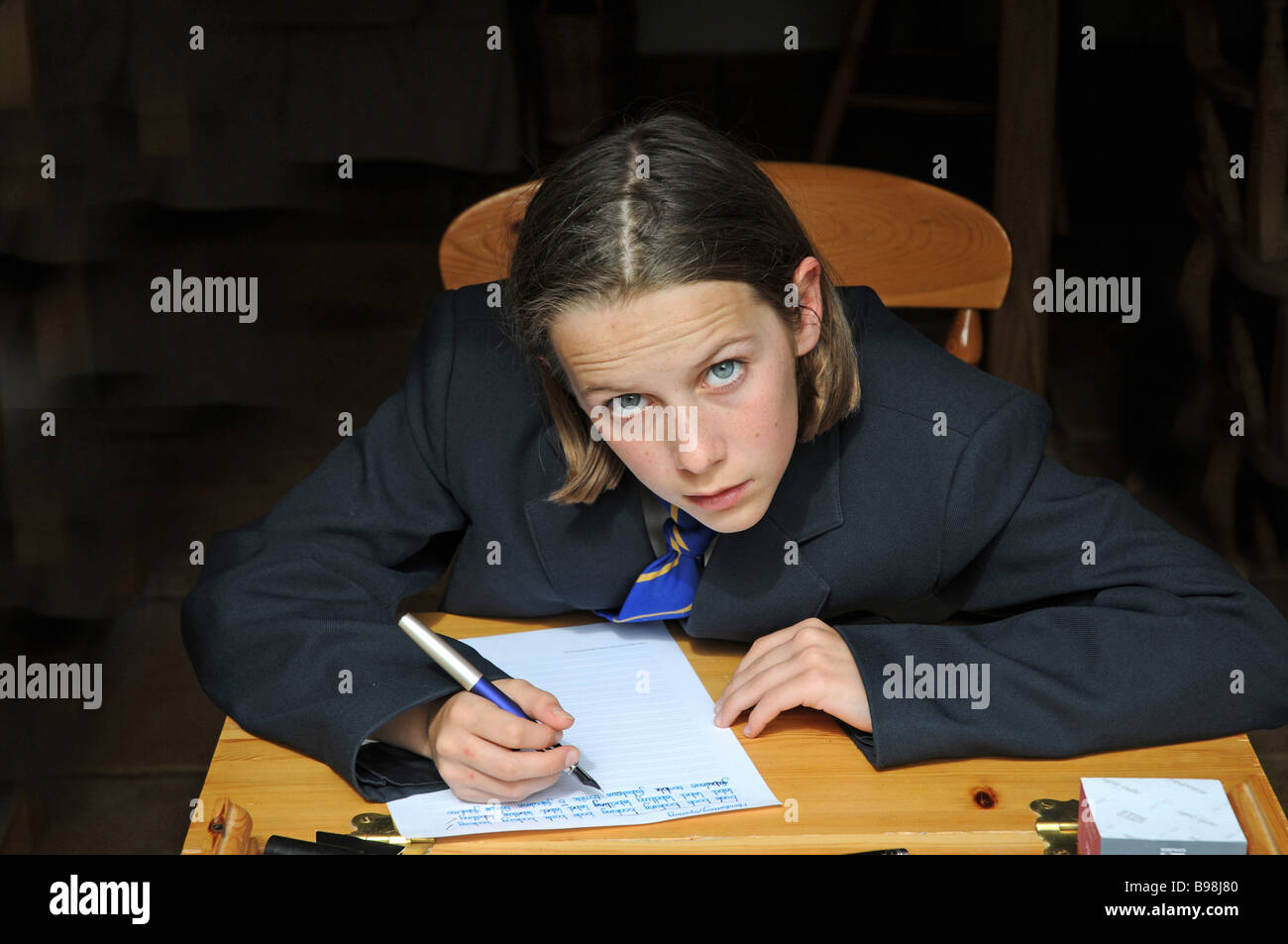interior portrait of girl doing homework Stock Photo - Alamy