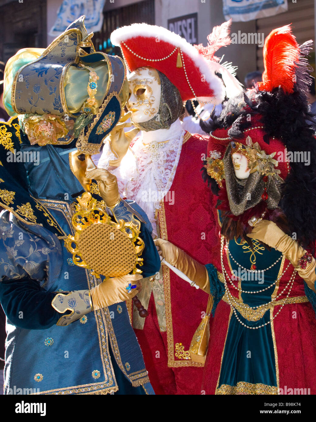 Three People in Carnival Costume Stock Photo - Alamy