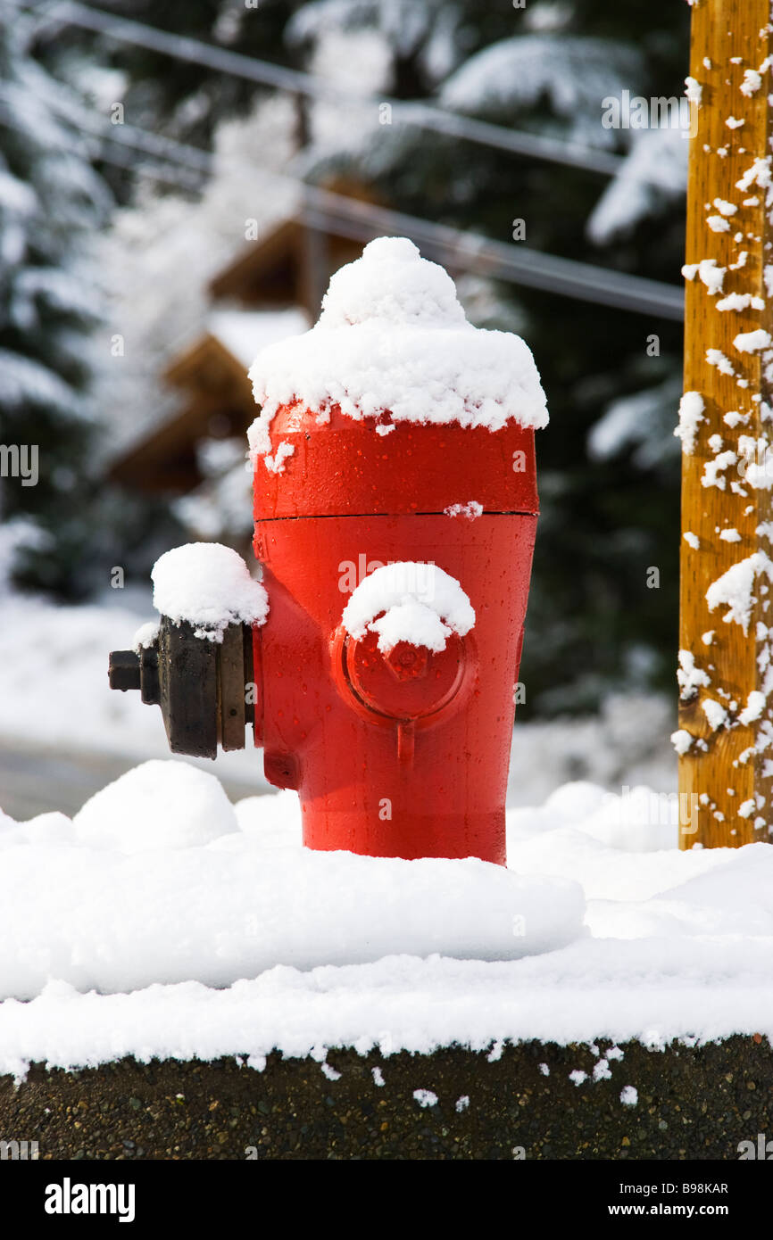 Snowy red fire hydrant Stock Photo - Alamy