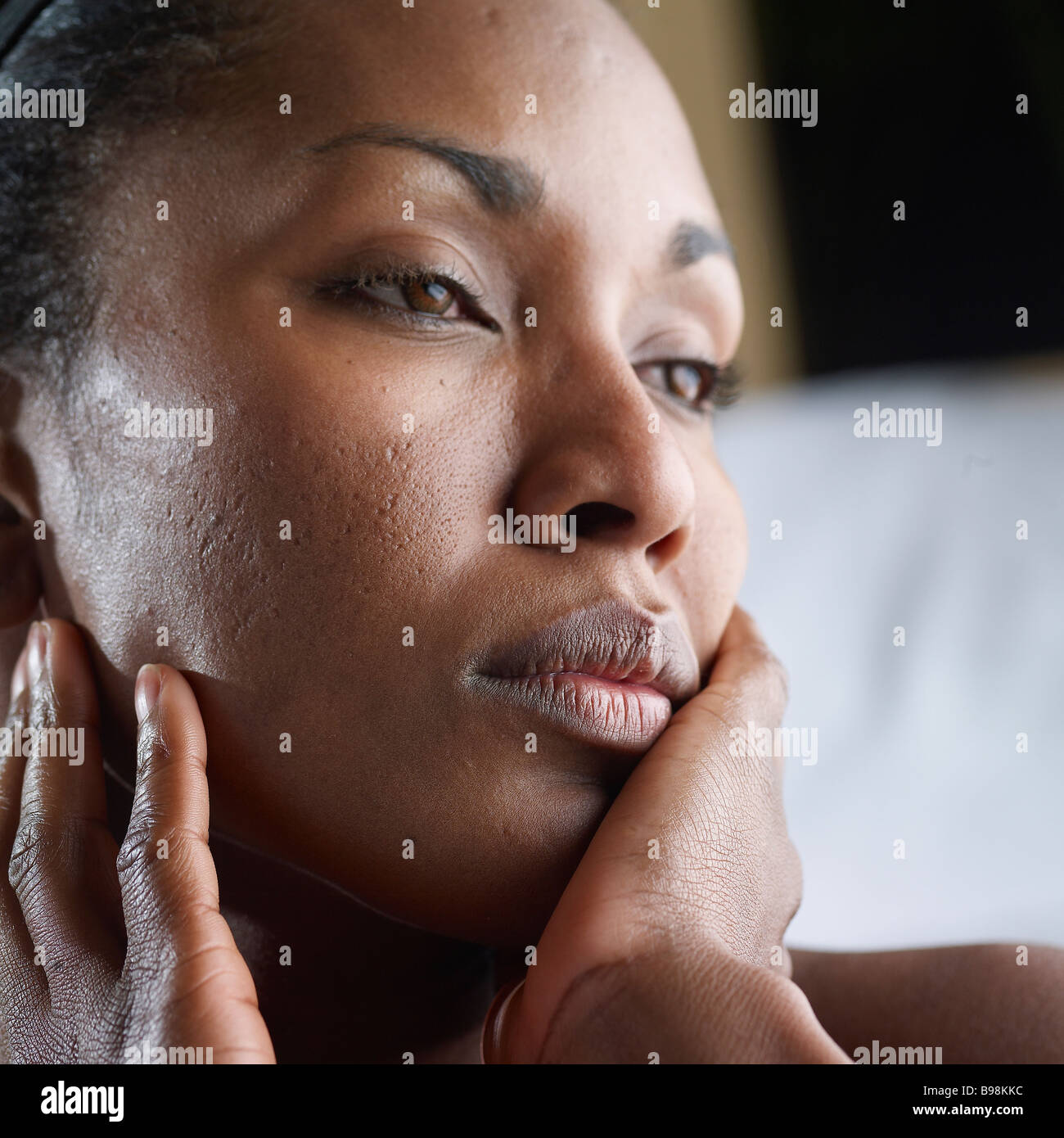 Black women holding hands to face Stock Photo - Alamy