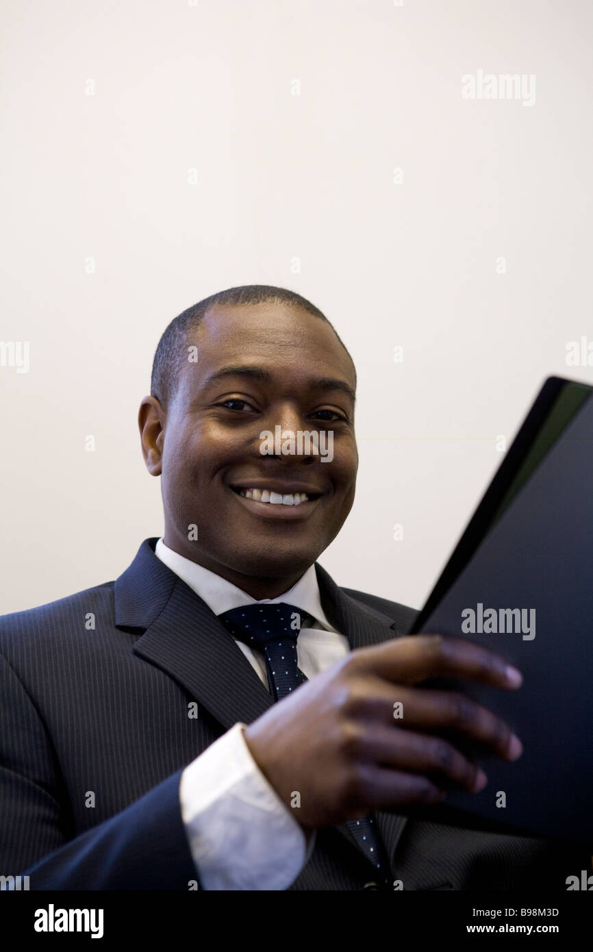 Businessman holding file Stock Photo - Alamy Businessman holding file Stock Photo - Alamy
