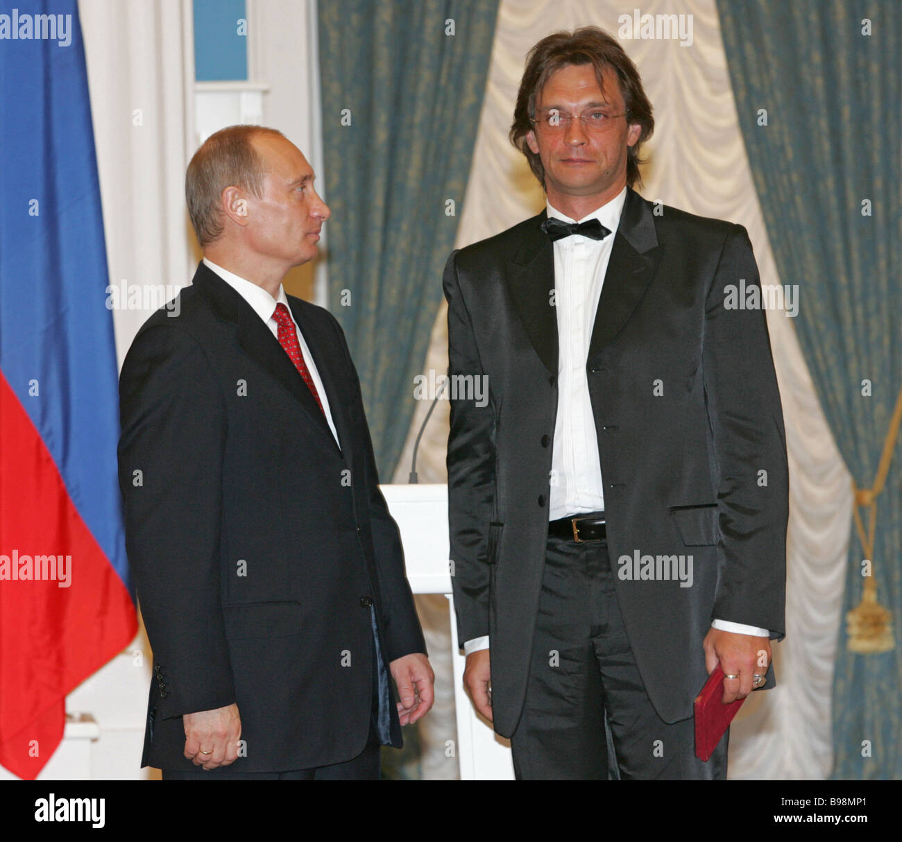 Russian President Vladimir Putin left congratulated actor Alexander ...