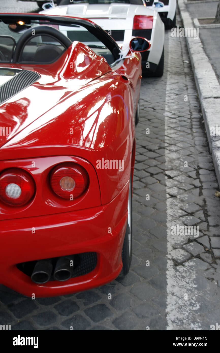 two ferrari sports cars in rome italy Stock Photo - Alamy