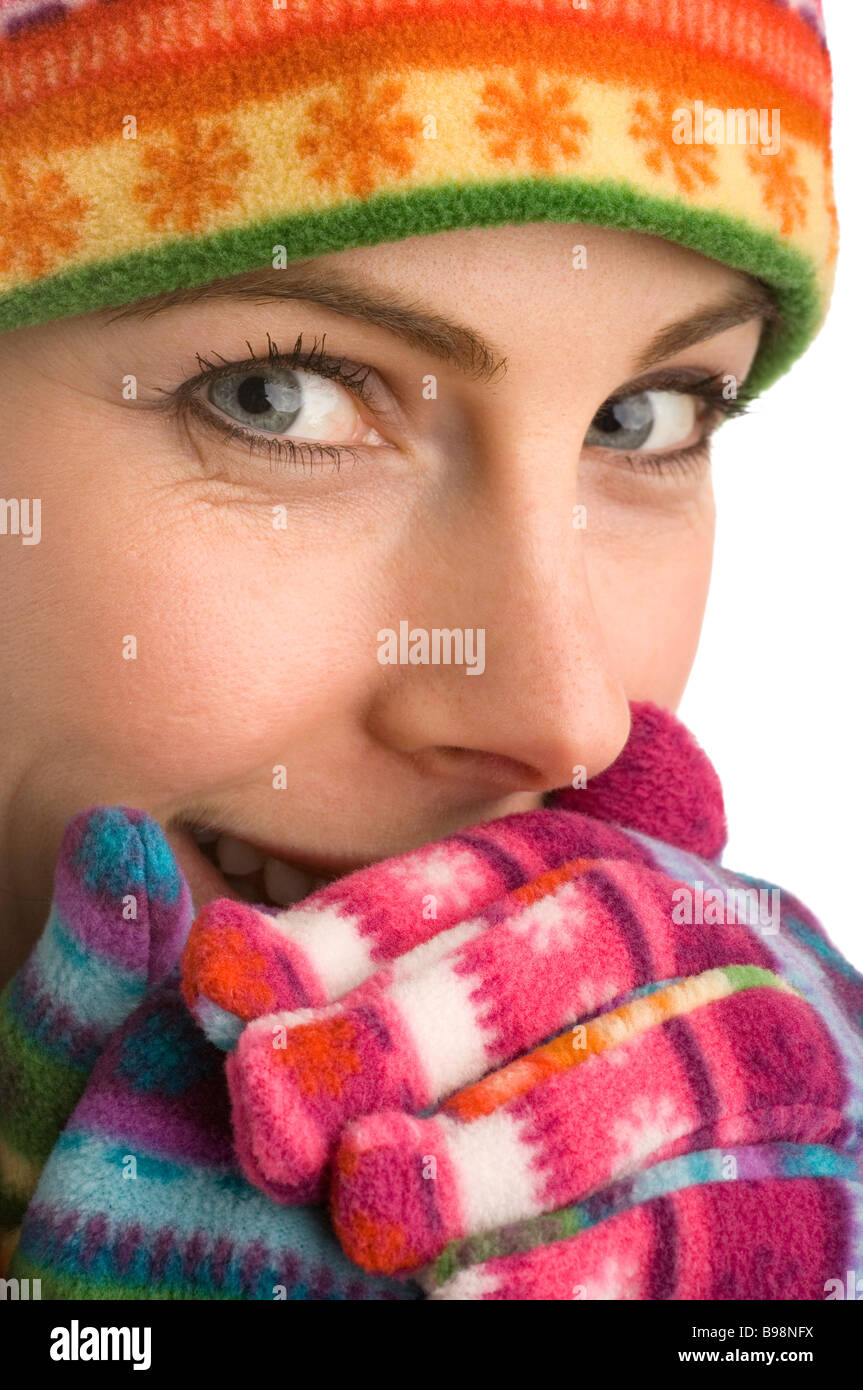 Studio portrait of woman wearing colorful winter clothing Stock Photo ...