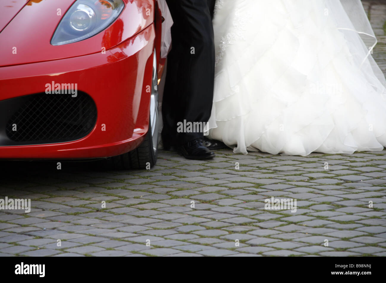 wedding couple with ferrari car in rome, italy Stock Photo - Alamy