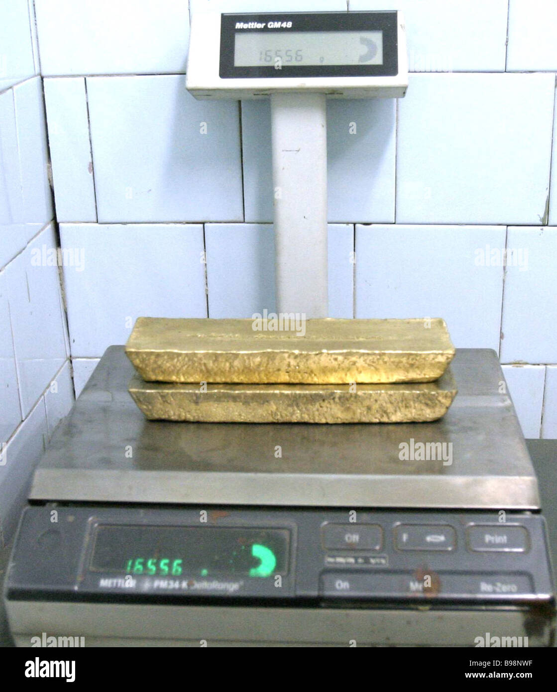Precision weighing of 16 kg gold bars at the Aldanzoloto extraction ...