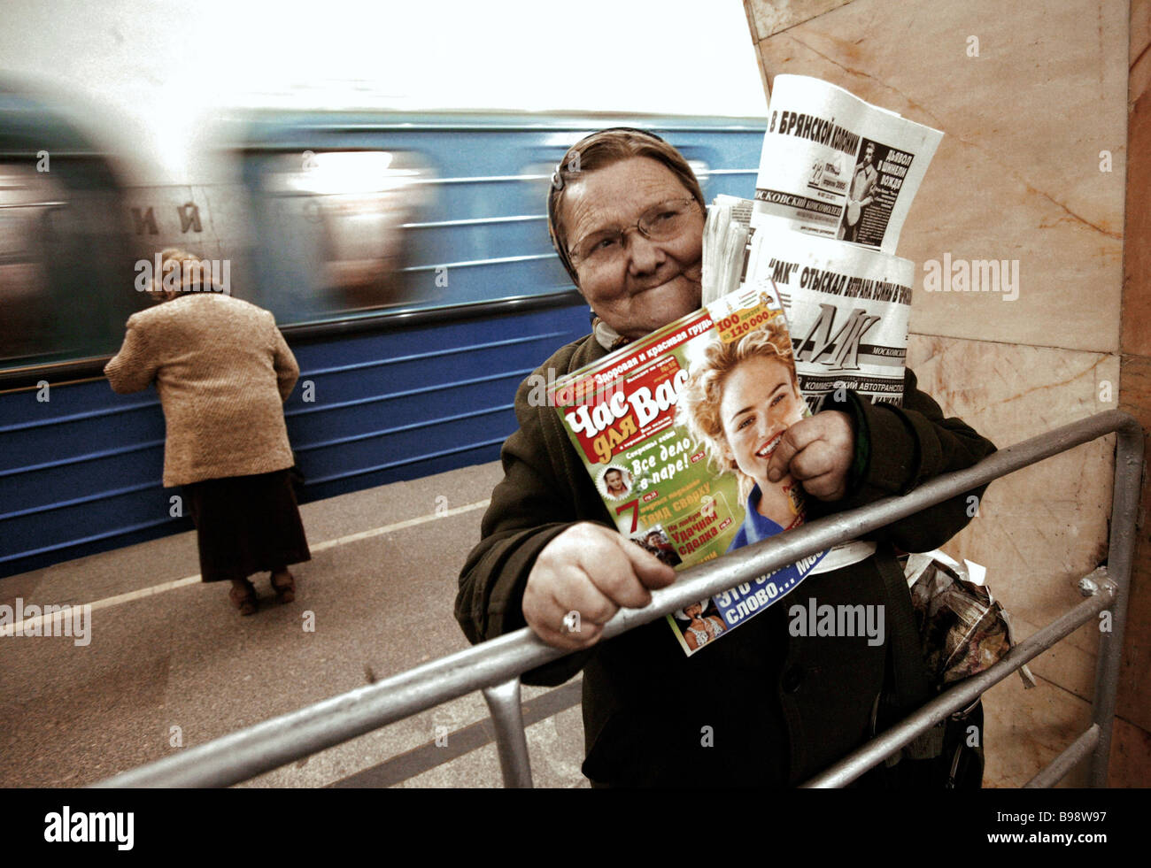 A woman selling newspapers in the Moscow underground Stock Photo - Alamy