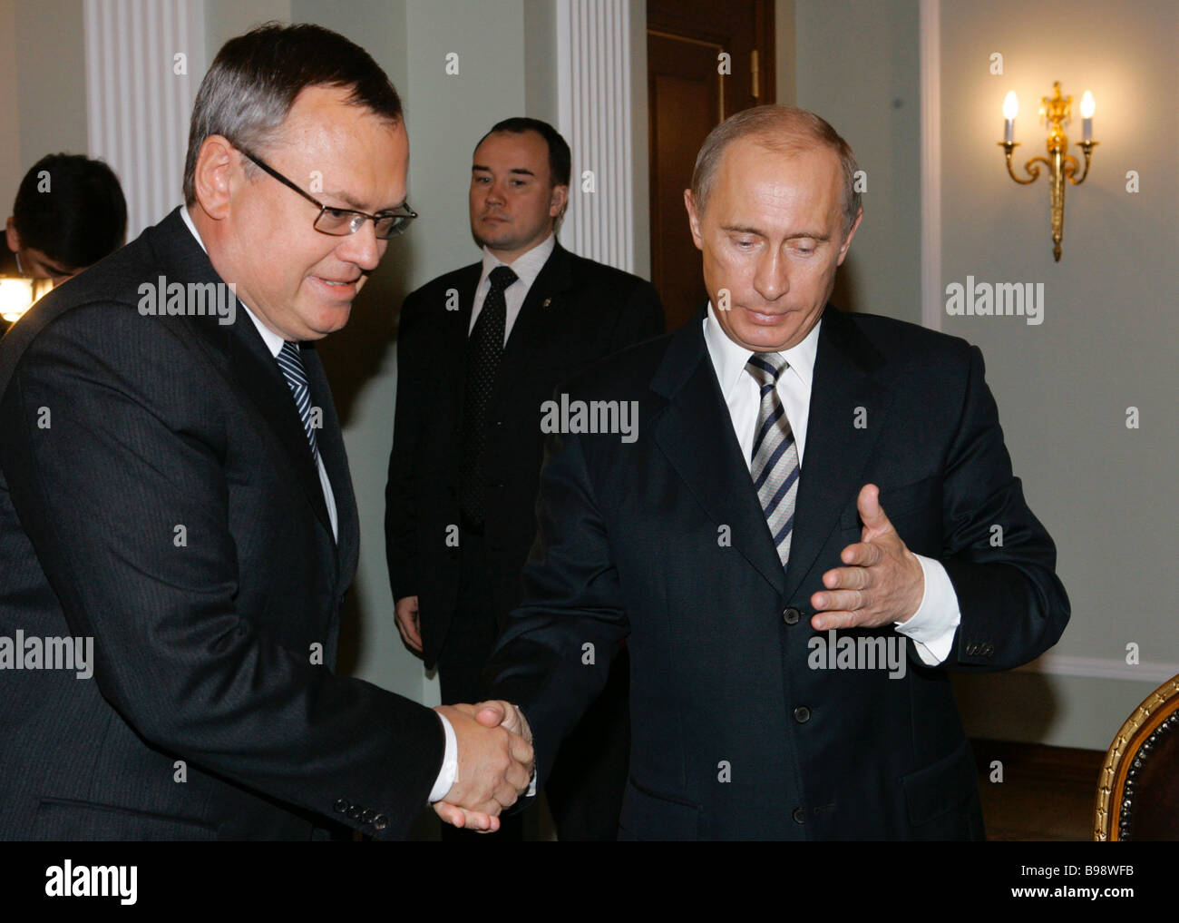 Russian President Vladimir Putin to the right and Andrei Kostin ...