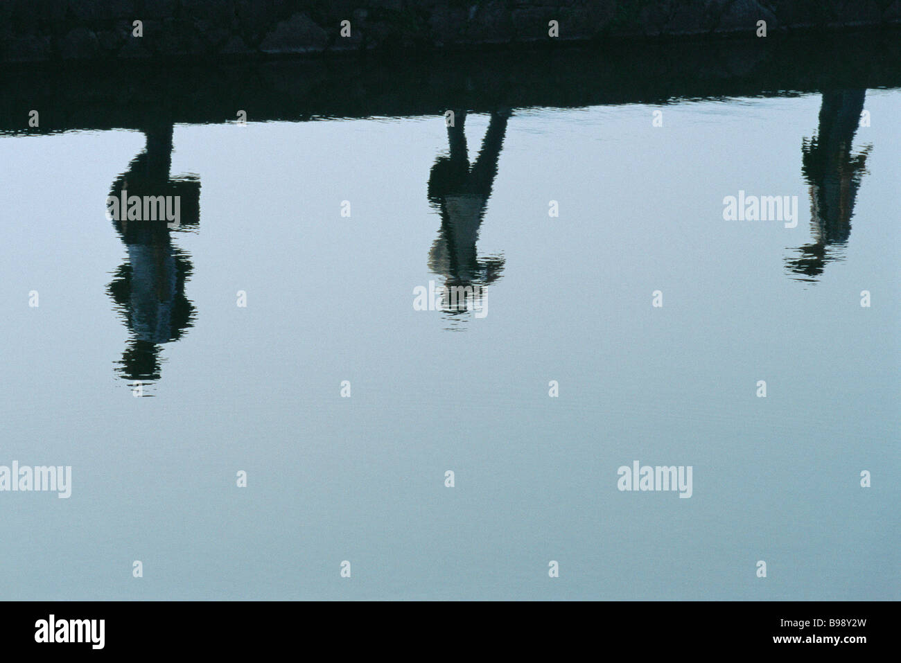 Three figures reflected hi-res stock photography and images - Alamy