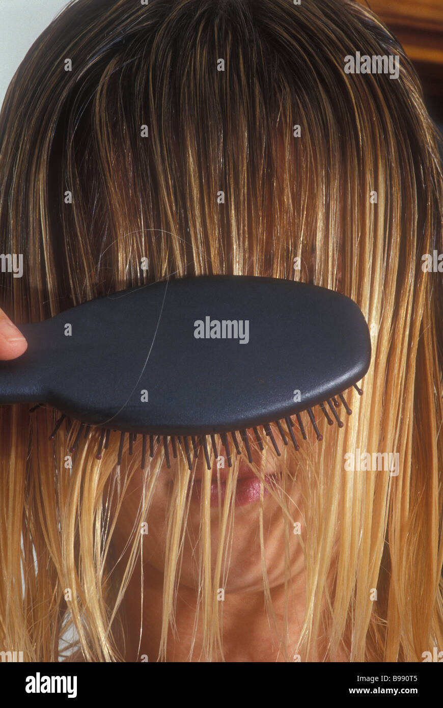 Brushing Wet Hair In Front of Face Stock Photo - Alamy
