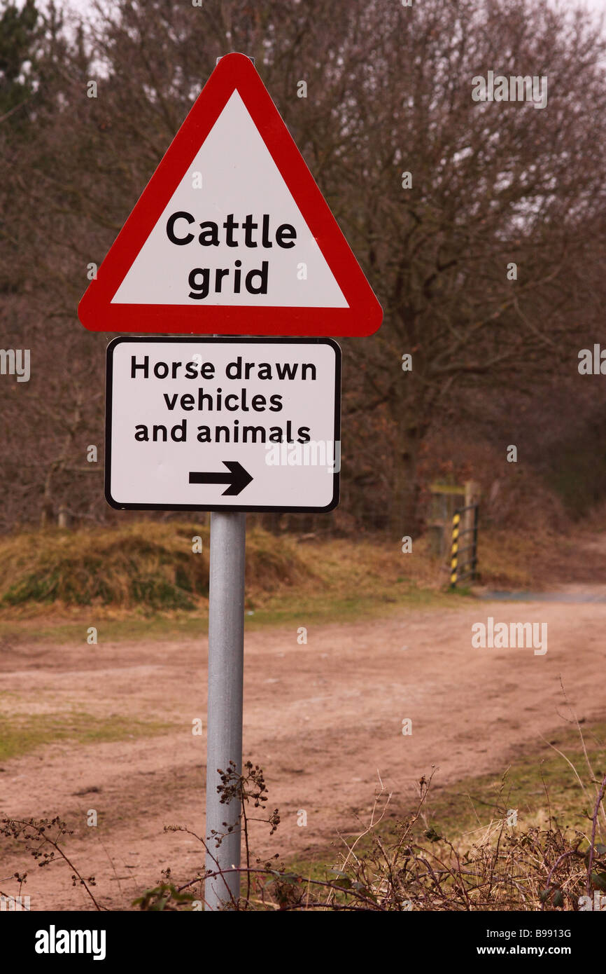 Cattle grid warning sign with arrow and information for horses and ...