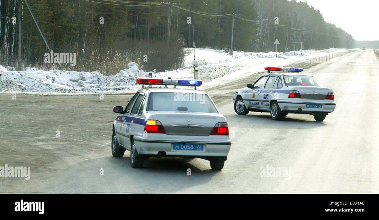 Traffic police cars on highway Stock Photo - Alamy