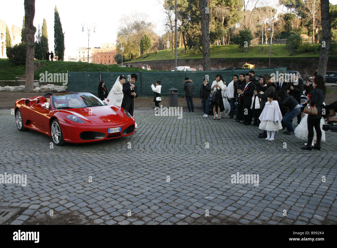 wedding couple with ferrari car in rome, italy Stock Photo - Alamy