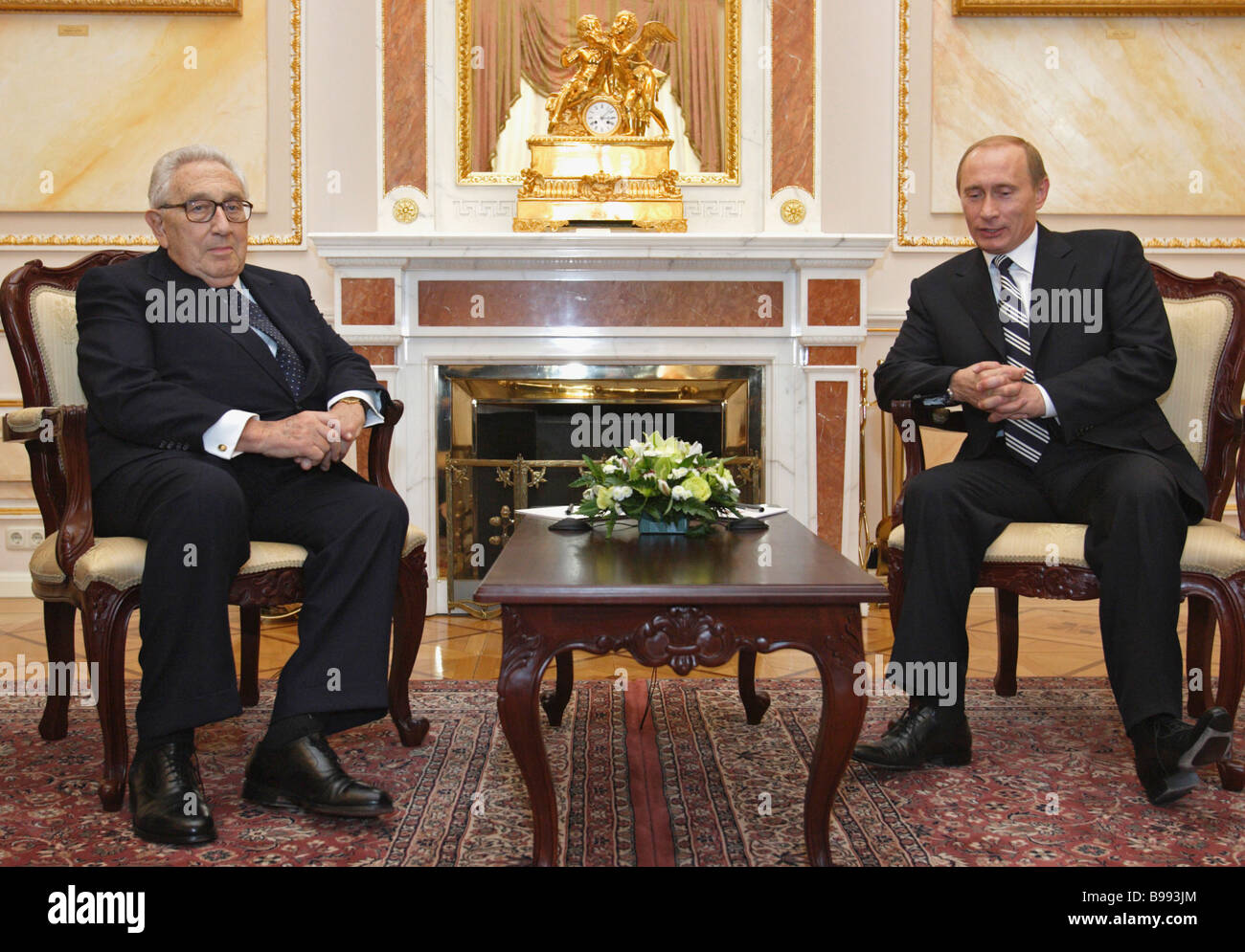 Russian President Vladimir Putin to the right receiving Henry Kissinger ...