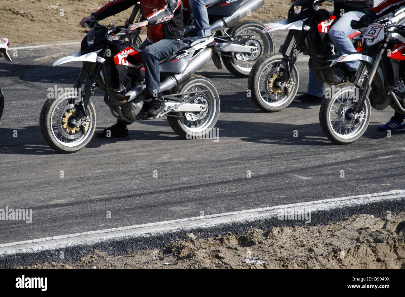 motorbikes in action on racing track outdoors Stock Photo - Alamy