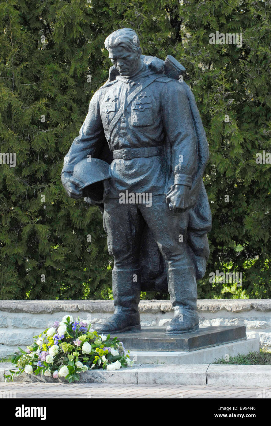 The Bronze Soldier statue is installed at a military cemetery in ...