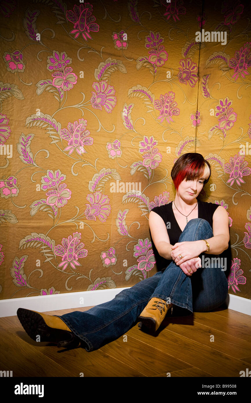 Girl sitting on the floor contemplating on life Stock Photo - Alamy