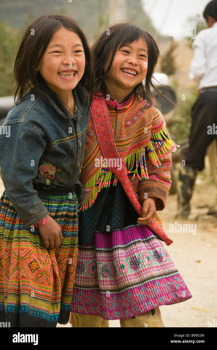 portrait of giggling Flower Hmong girls in Cau Son near Bac Ha Vietnam ...