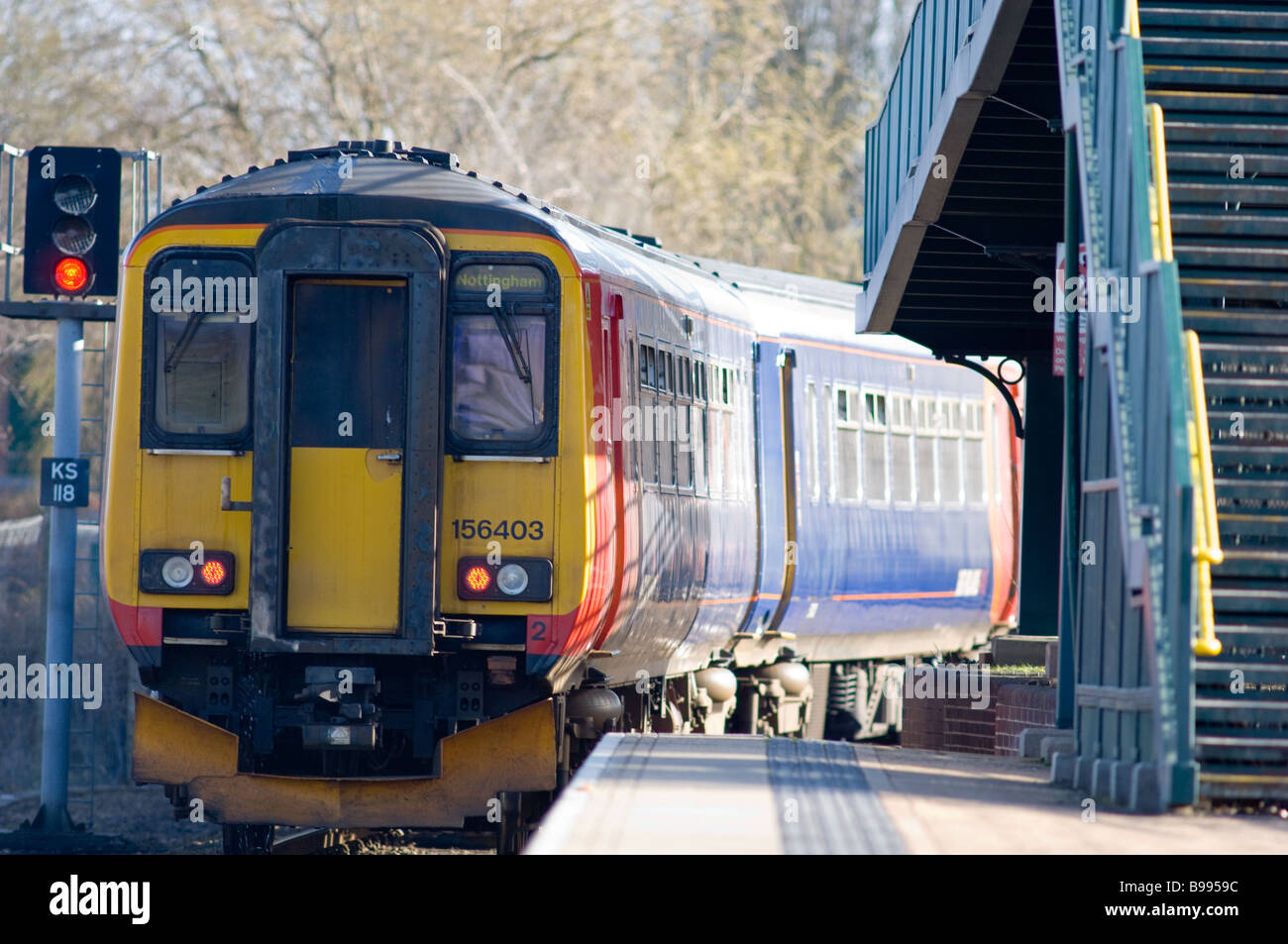 Commuter train pulling out of the local train station after a snow fall ...