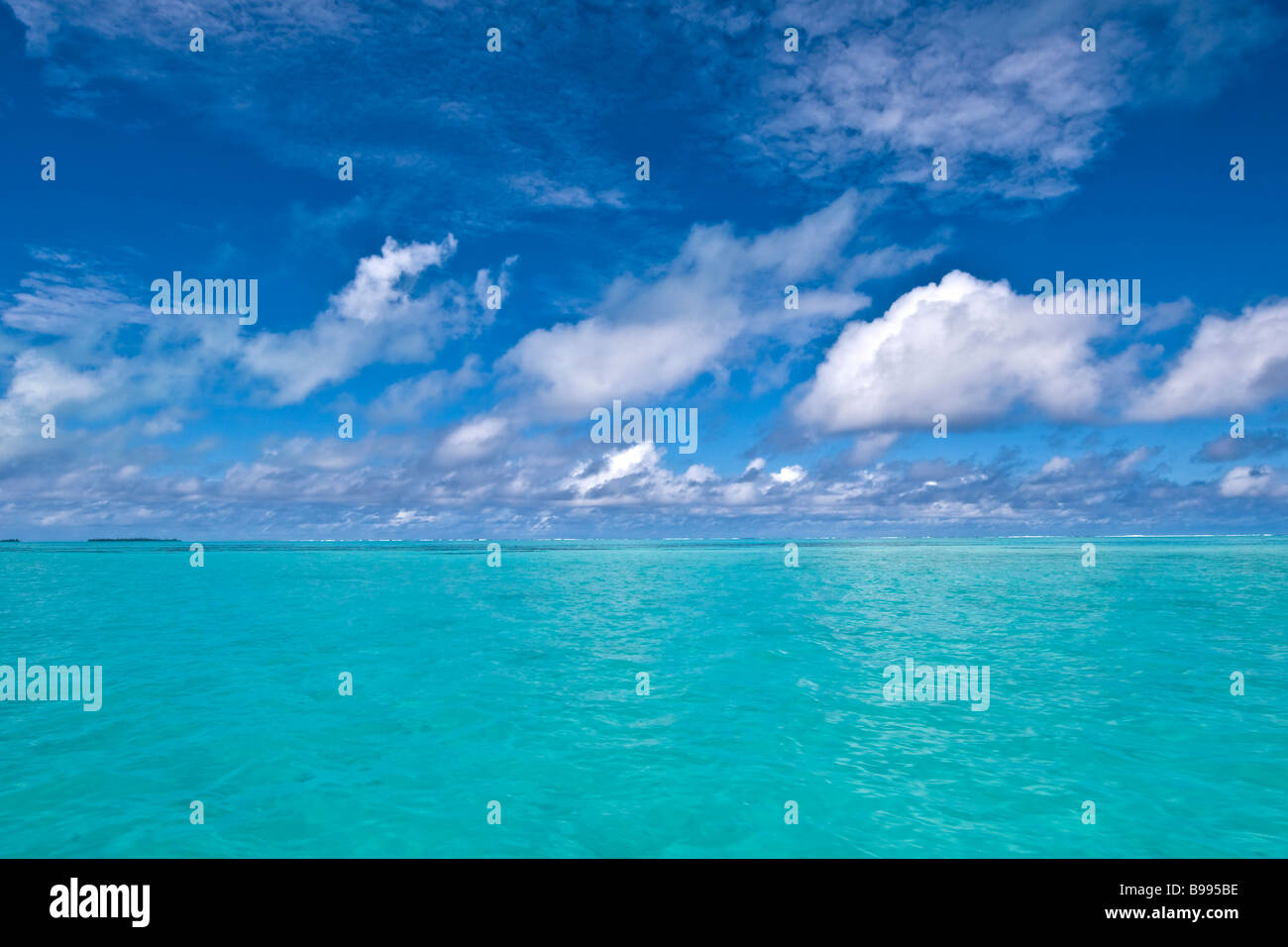Turquoise water meets blue sky with Maina Island in background just off ...