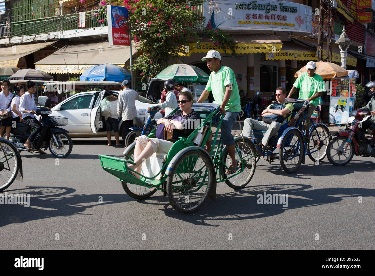 Tourists on Rickshaws Phnom Penh Cambodia Stock Photo - Alamy