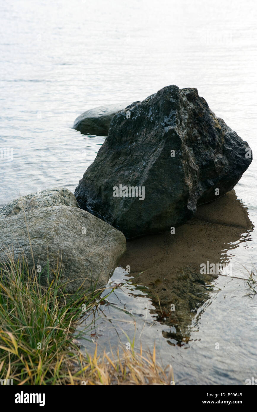 Boulders in shallow water Stock Photo - Alamy