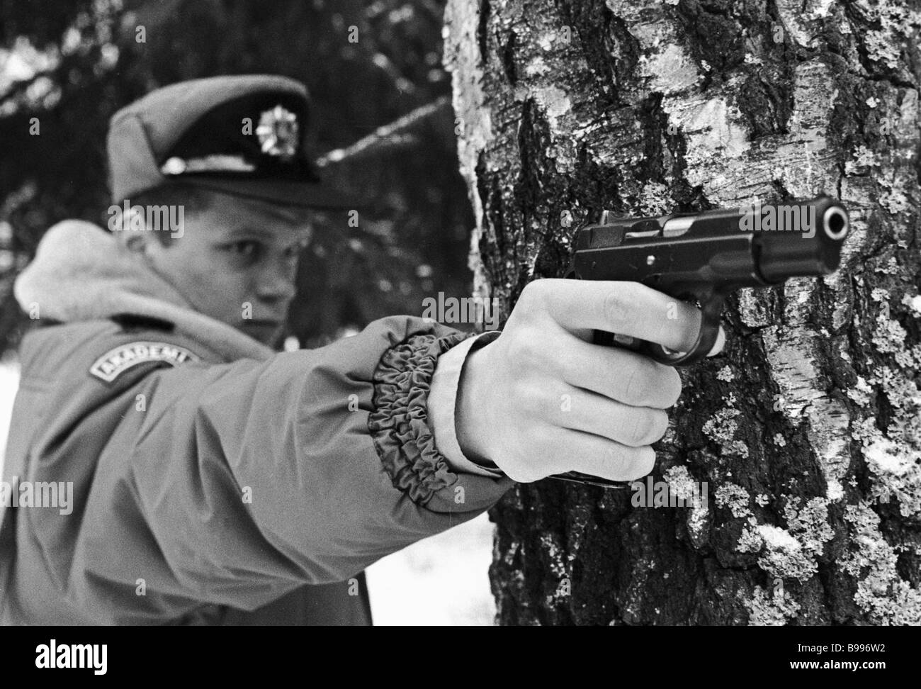 Police academy cadet aims handgun during target shooting practice Stock ...