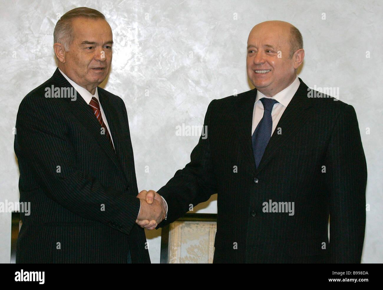 Uzbek President Islam Karimov To The Left Meeting With Russian Prime