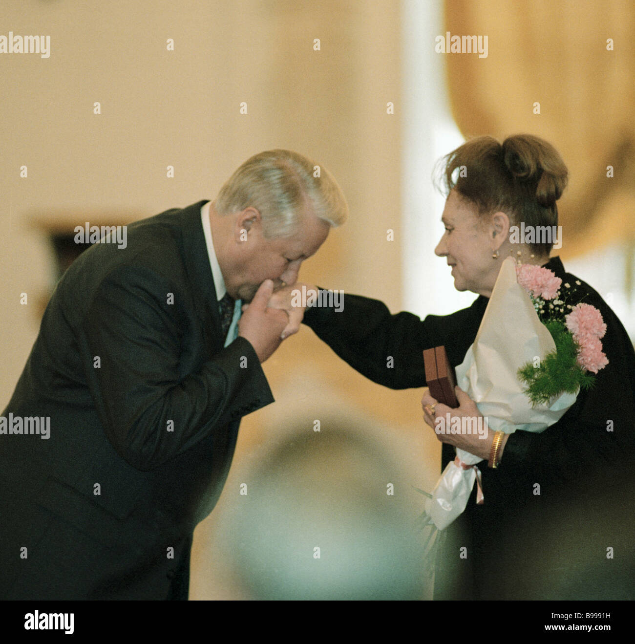 President Boris Yeltsin left handing the Order of Merit for the ...