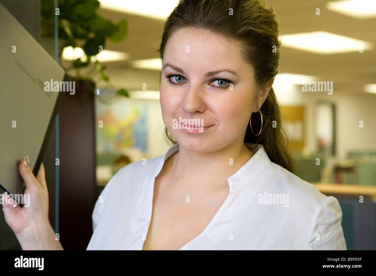 Businesswoman holding files Stock Photo - Alamy