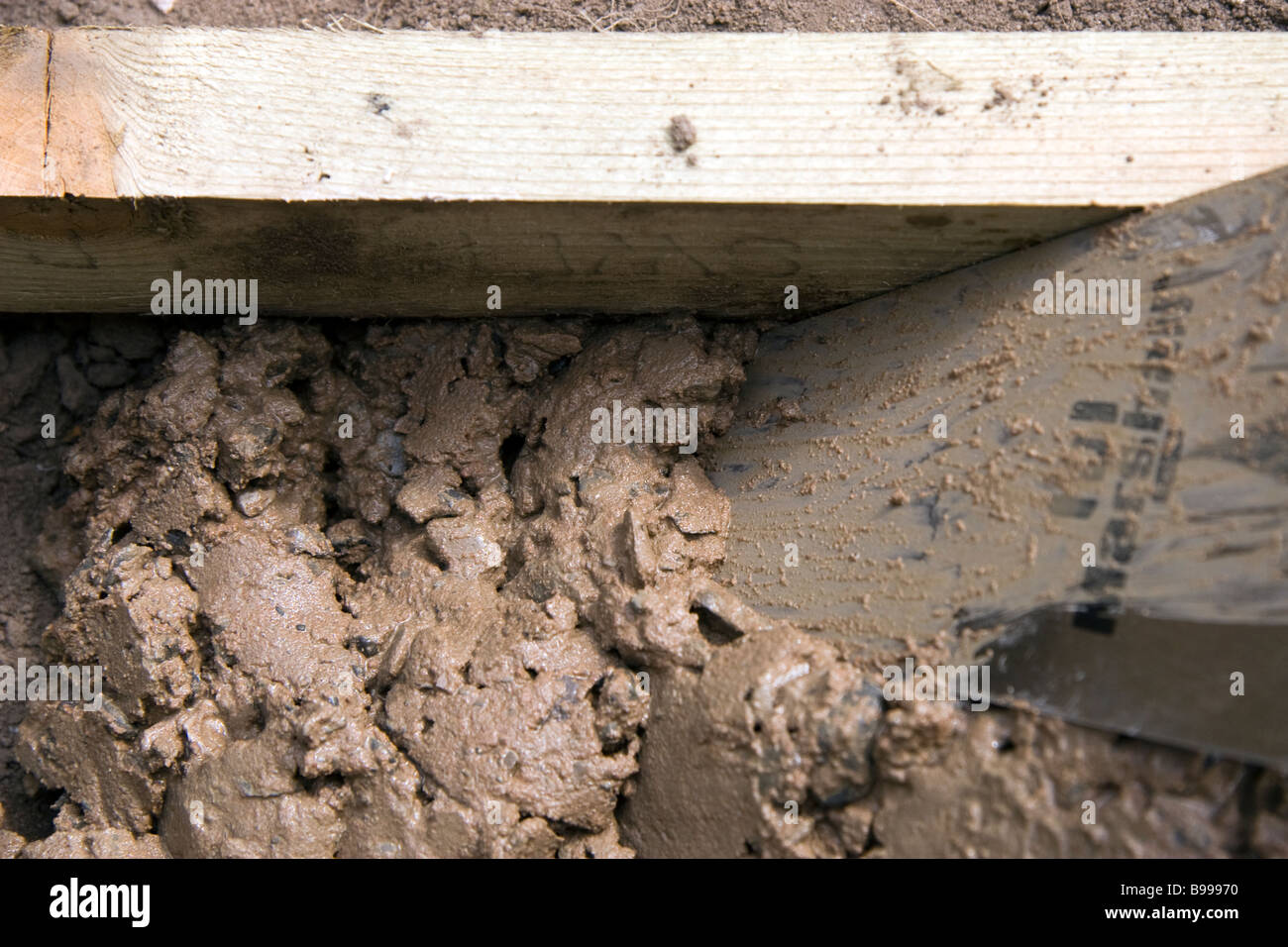 A floating trowel is used to ensure that the concrete mix has ...