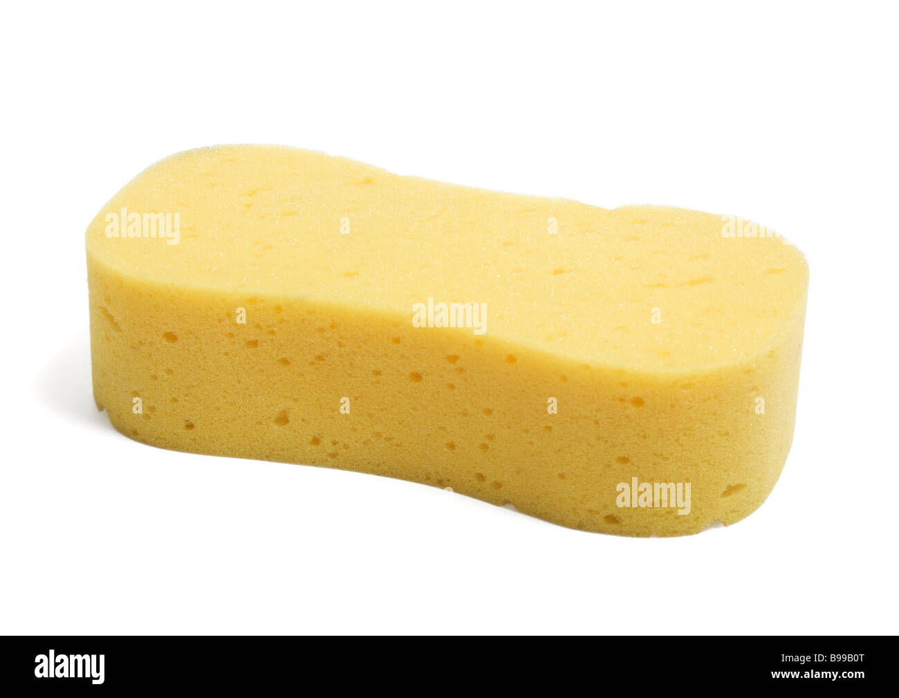 Yellow sponge on white background Stock Photo - Alamy