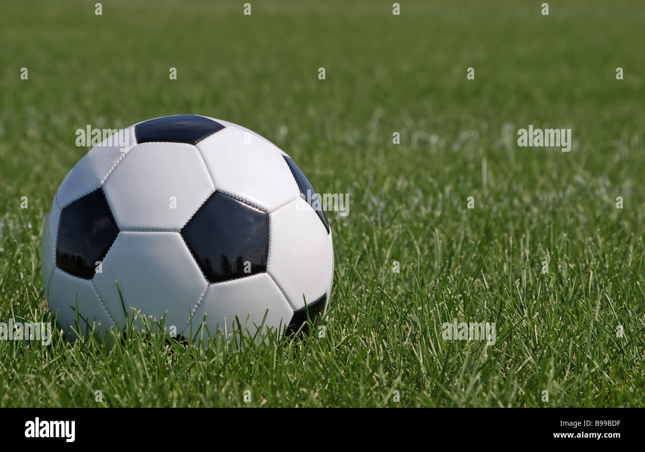 Soccer ball close up with goal in the background Stock Photo - Alamy