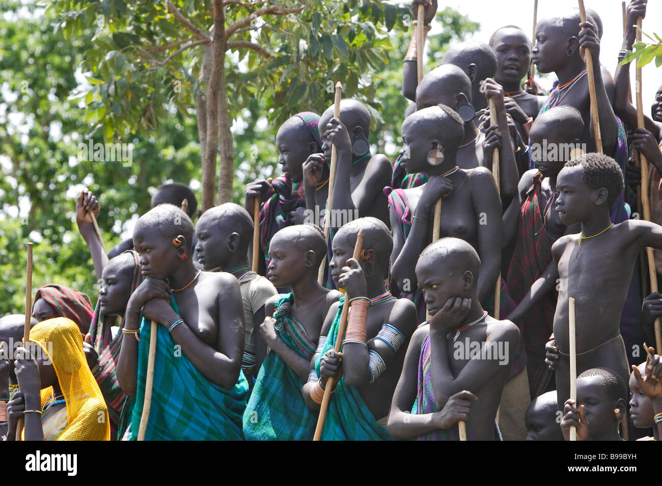 Surma girls watching a traditional donga fight Stock Photo - Alamy