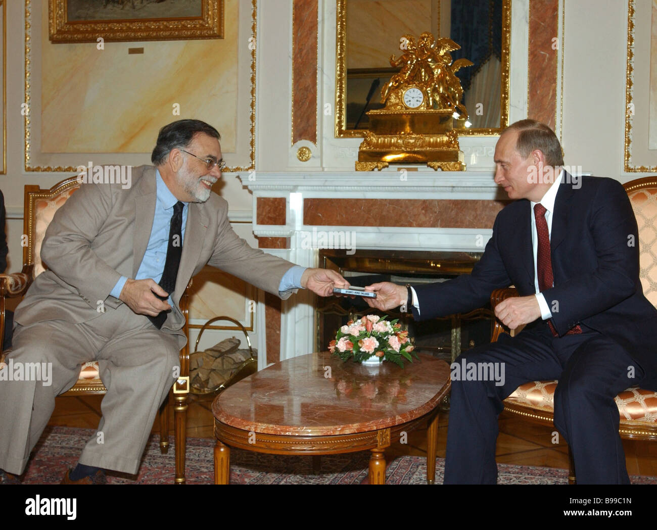 Russian President Vladimir Putin right receiving American film director ...