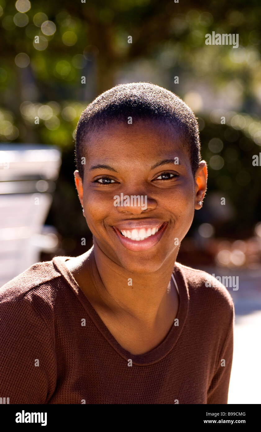 Attractive black African American woman portrait with short hair and ...