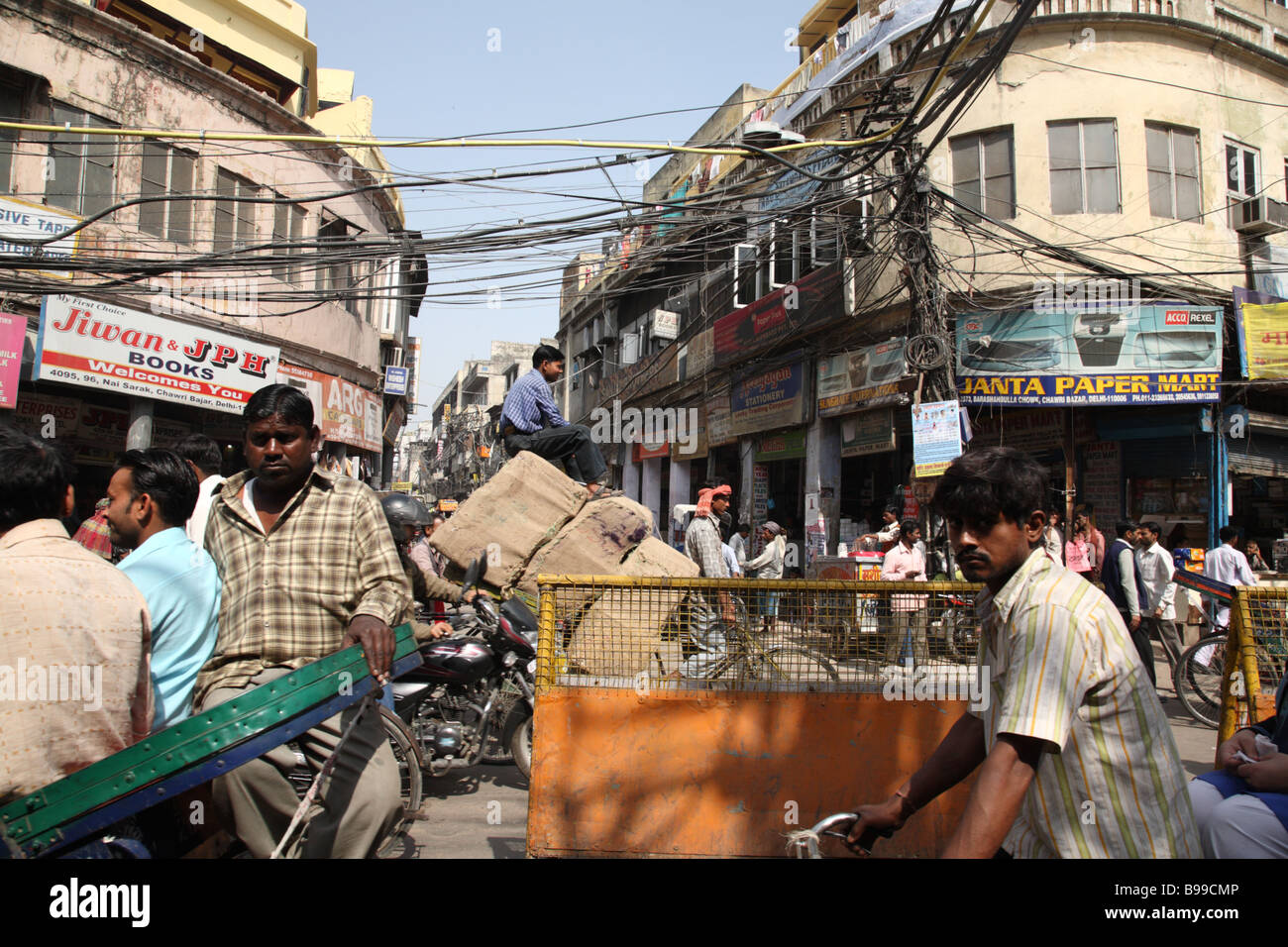 People transport goods by cart and move about an intersection in Old ...