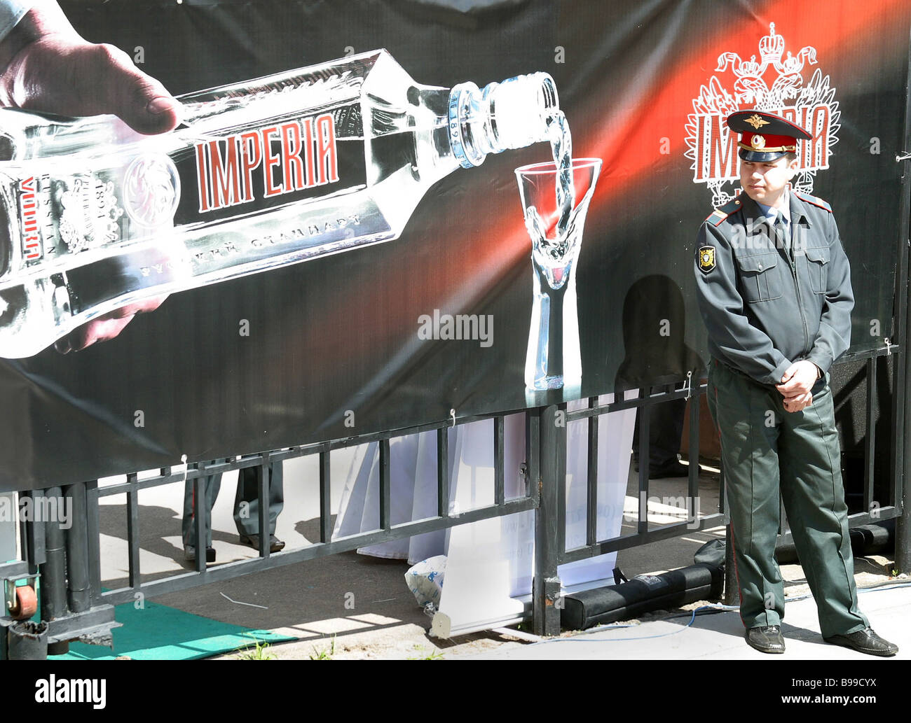 A policeman on guard at a vodka advertisement Stock Photo - Alamy