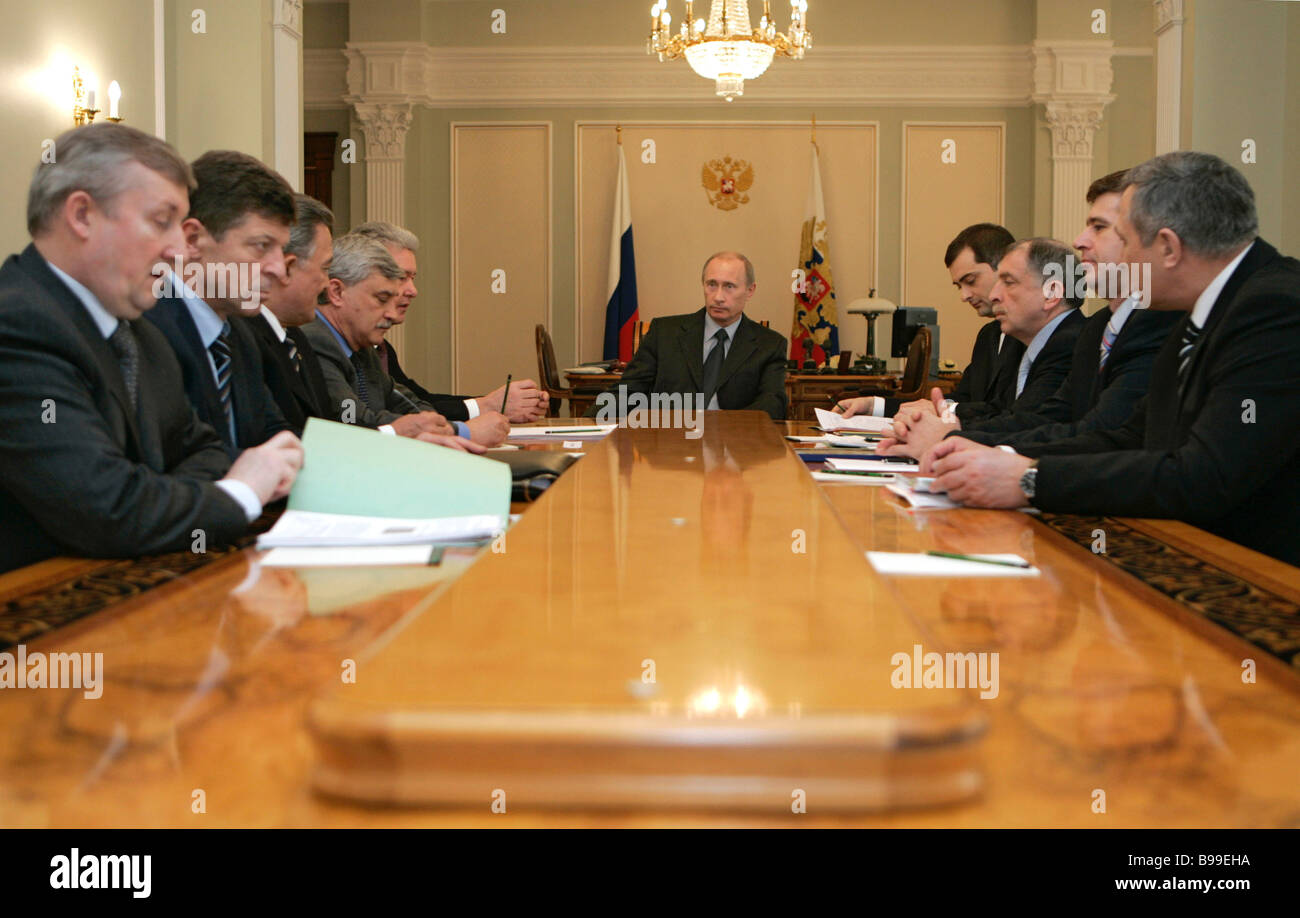 Russian President Vladimir Putin center during a meeting in Novo ...