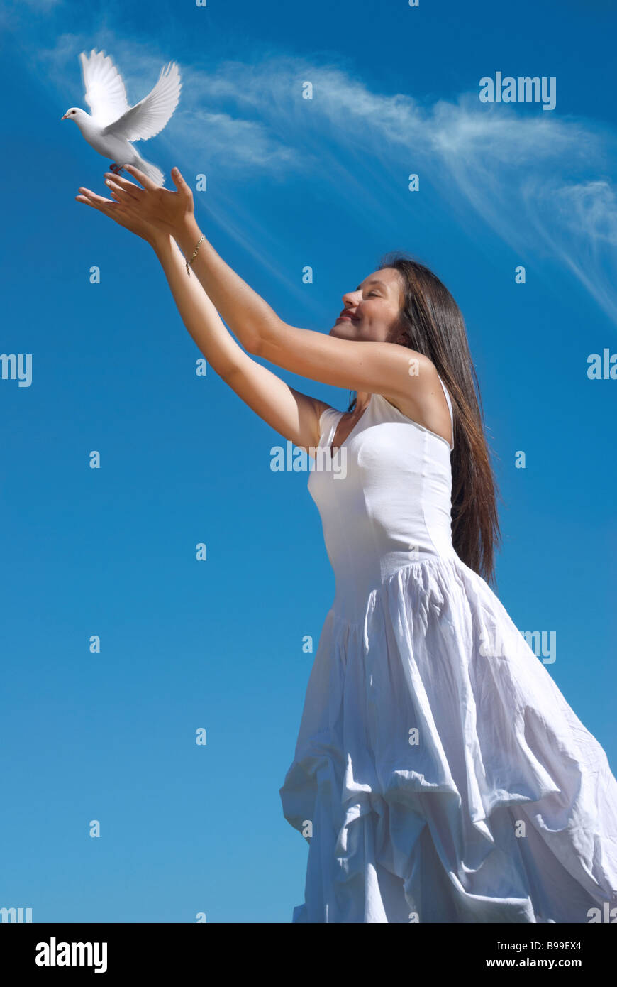 Woman releasing bird hi-res stock photography and images - Alamy