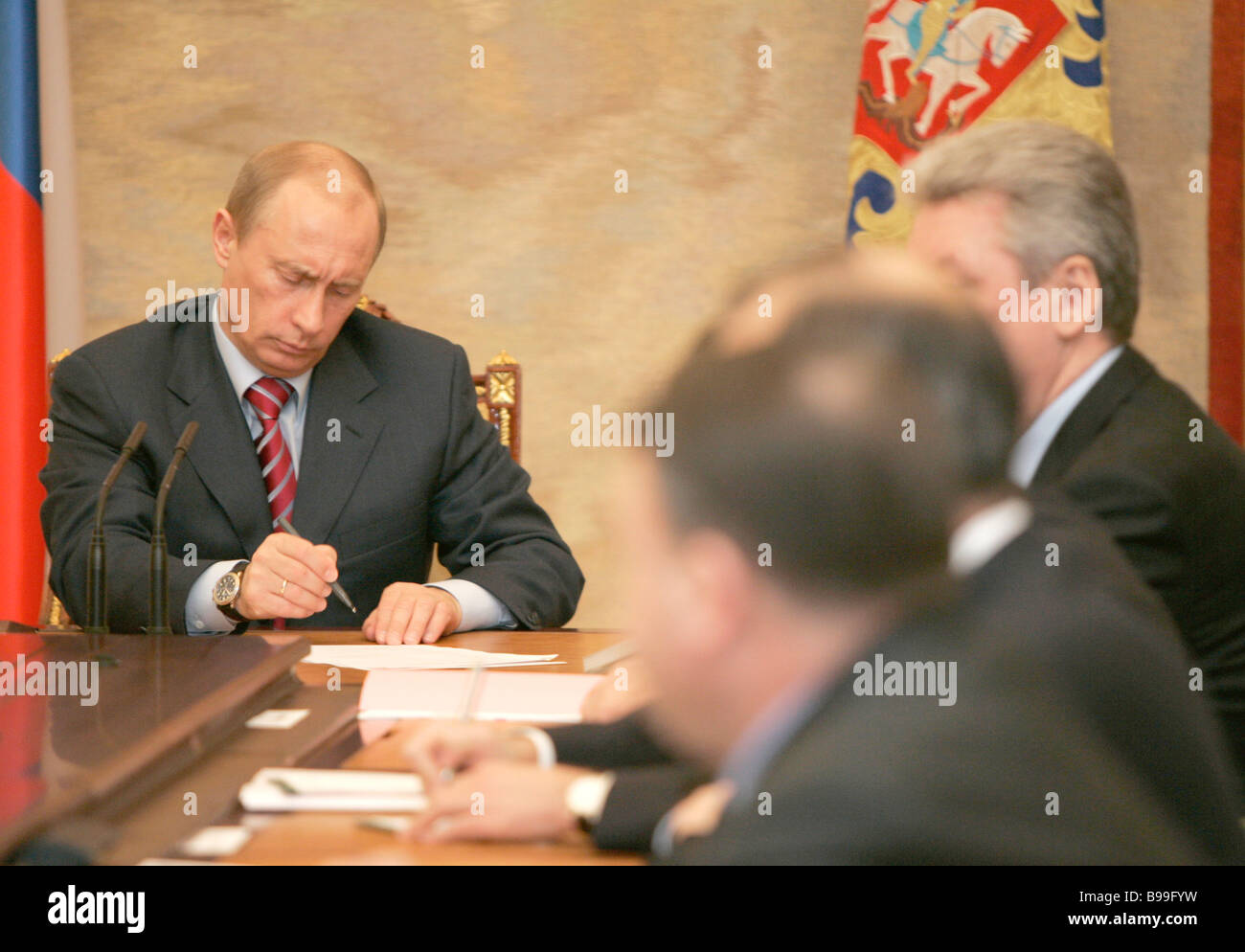 Russian President Vladimir Putin left at a Cabinet meeting in the ...