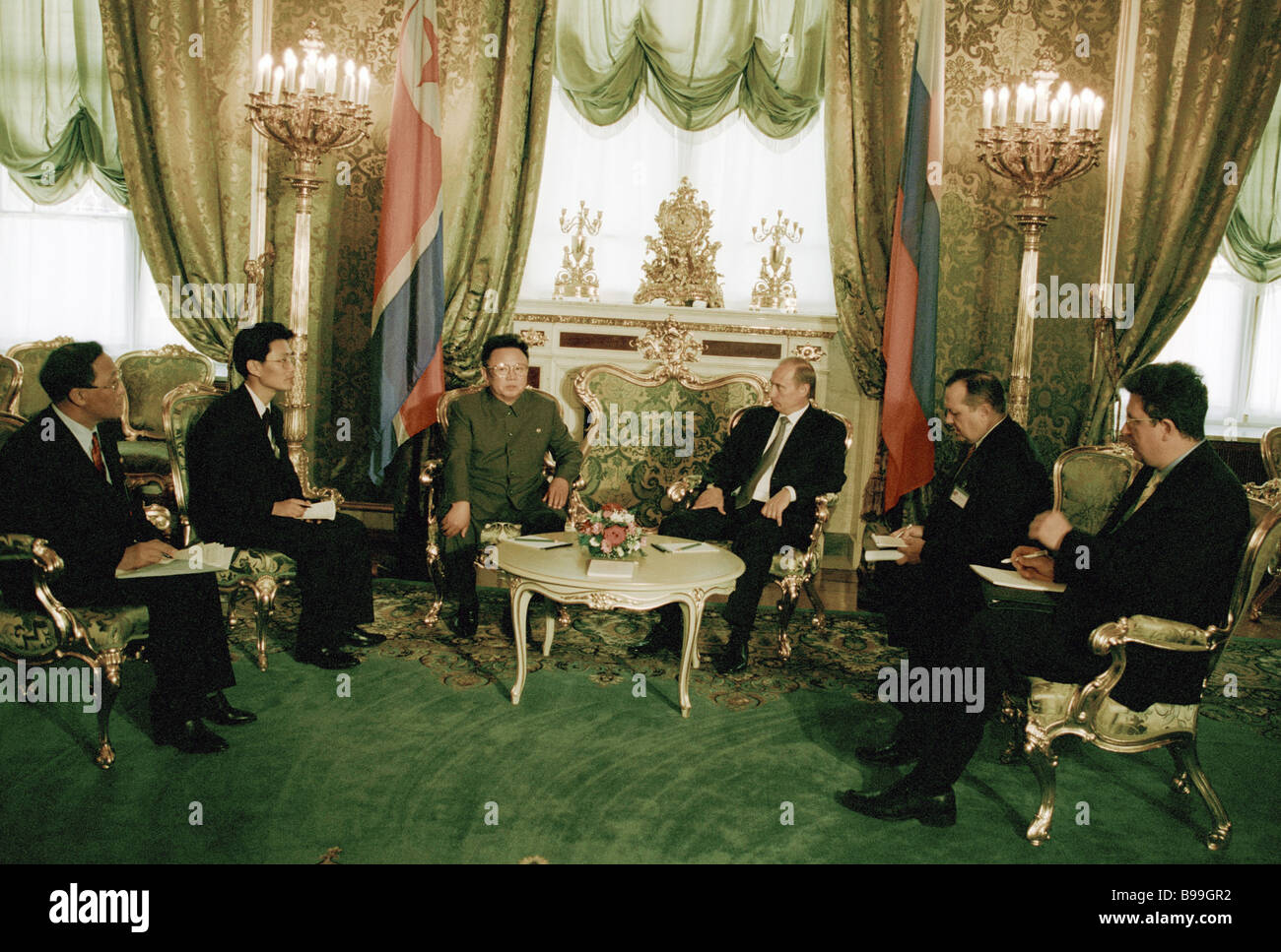 Russian President Vladimir Putin at the table right and Kim Jong Il ...