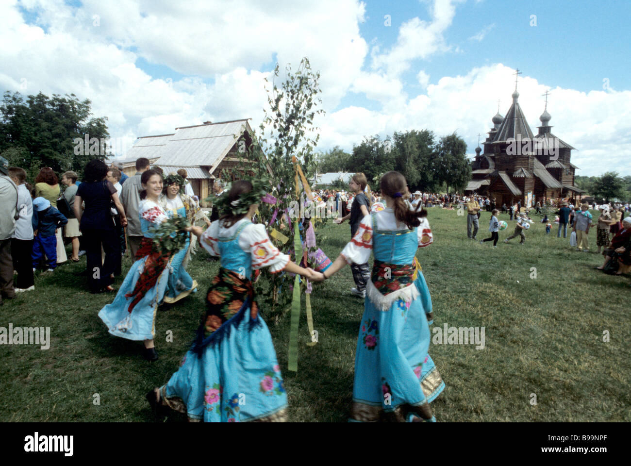 Dancing round decorated birch tree on St Trinity Day Stock Photo - Alamy