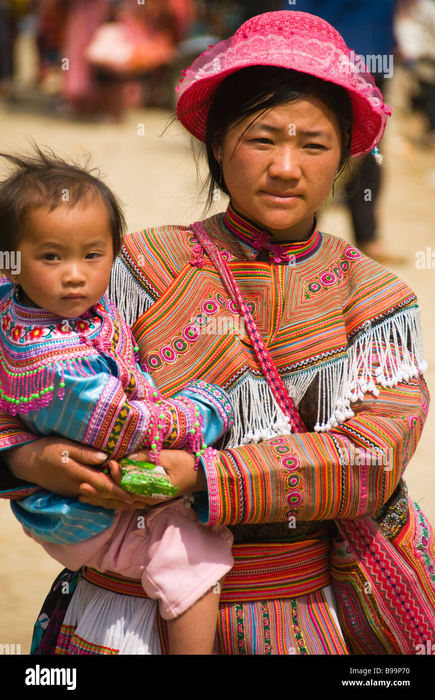 colorful Flower Hmong woman and her baby in the market in Cau Son near ...